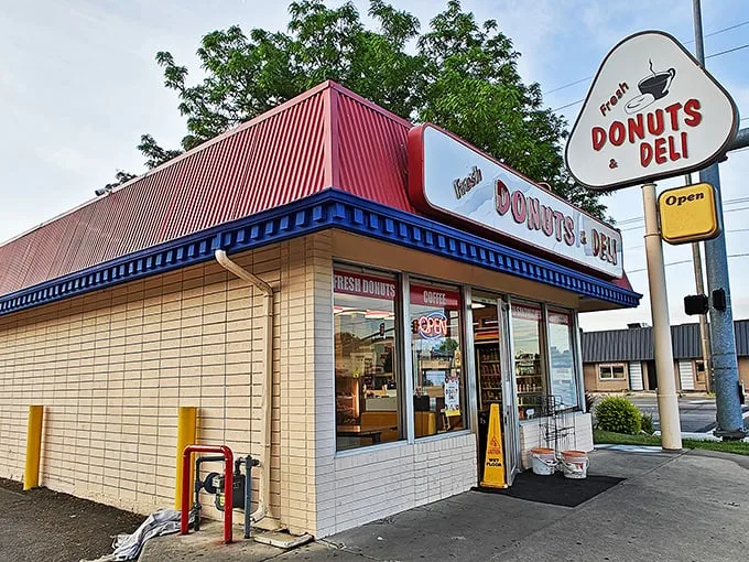 A donut oasis in the desert! This unassuming shop, with its cheery red roof and retro sign, promises sweet salvation for sugar-seekers.
