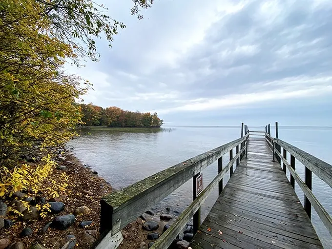 Gateway to tranquility! This wooden pier stretches into Mille Lacs Lake like a runway for daydreams, inviting you to leave your worries on the shore.