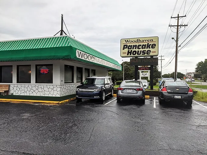 A green-striped awning beckons like a breakfast lighthouse, guiding hungry souls to this unassuming pancake paradise. No frills, just thrills for your taste buds.