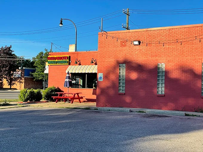 A red-brick beacon of flavor! Gus's exterior promises a no-frills experience that's all about the chicken. It's like the Fort Knox of fried poultry – plain outside, but pure gold within.