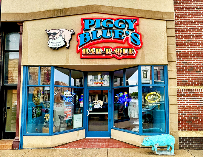 Welcome to Piggy Blue's, where the neon sign is as bright as the flavors inside! This barbecue joint's exterior promises a feast for both your eyes and your taste buds.
