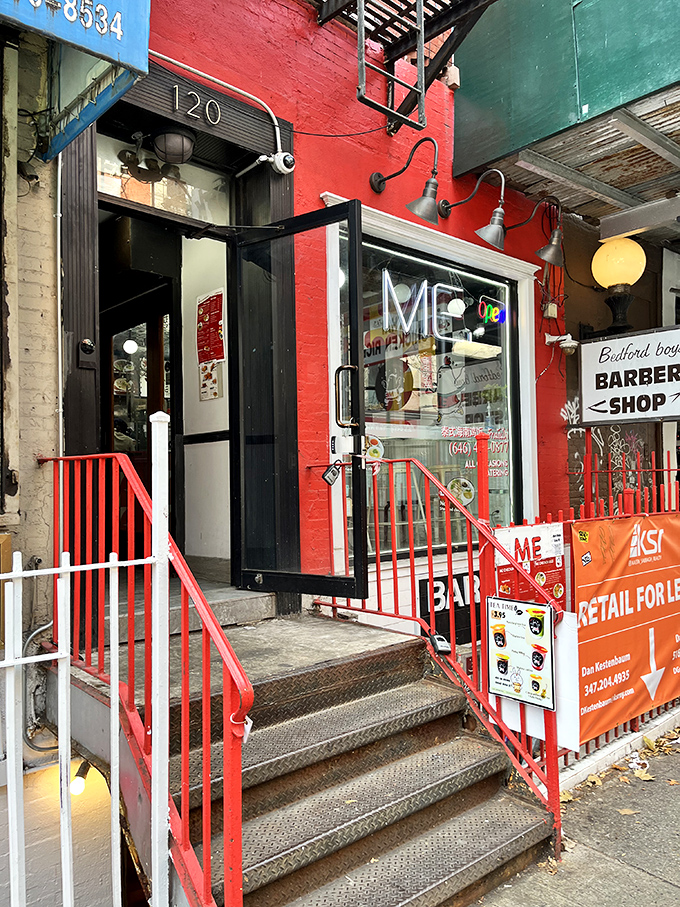 A splash of red in the urban jungle! This vibrant storefront promises a chicken adventure that'll ruffle your feathers in the best way possible.