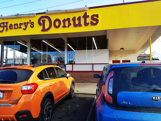 Welcome to donut paradise! Henry's Donut stands proud against the Washington sky, promising sweet delights within its unassuming exterior.