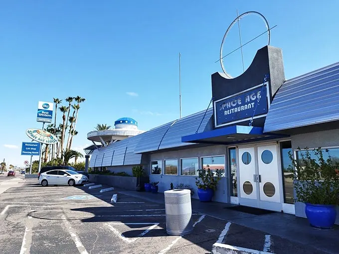 Welcome to the future… of dining! The Space Age Restaurant's exterior is a retro-futuristic feast for the eyes, complete with porthole windows and a sign that screams "The Jetsons were here!"