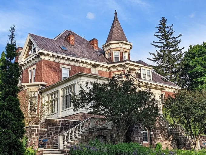 A Victorian dream come to life! This architectural masterpiece looks like it jumped straight out of a Wes Anderson film, but with more maple syrup.