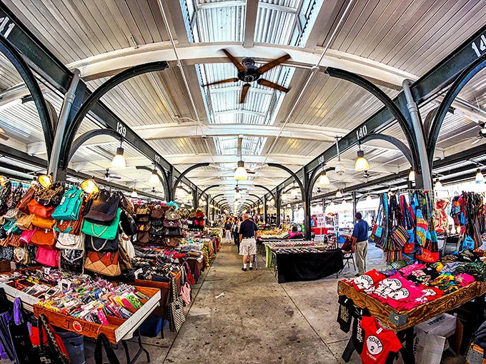Vibrant stalls at the French Market, New Orleans, offering unique souvenirs, local crafts, and colorful goods under historic covered pavilions.