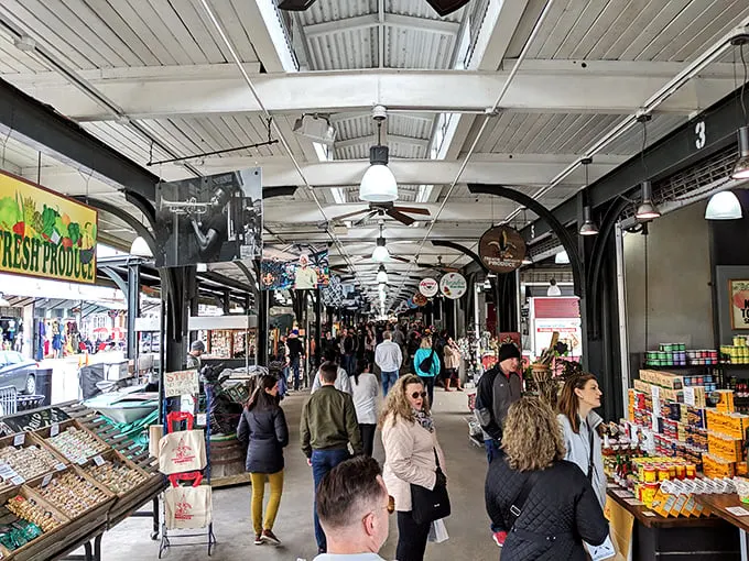 Vibrant stalls at the French Market, New Orleans, offering unique souvenirs, local crafts, and colorful goods under historic covered pavilions.