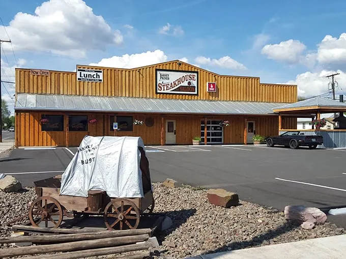 Welcome to beef paradise! Barney Prine's rustic exterior promises a steak-lover's dream, with those red umbrellas beckoning like beacons of deliciousness.