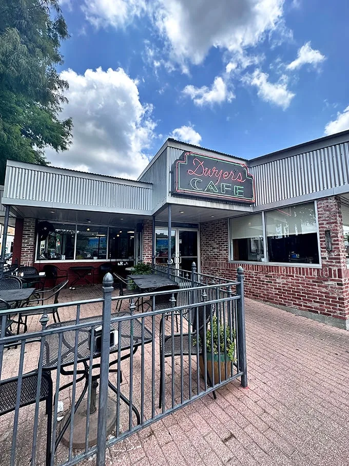 A neon sign that could guide hungry sailors home! Dwyer's Cafe stands proud, a brick-and-mortar beacon of breakfast bliss in downtown Lafayette.