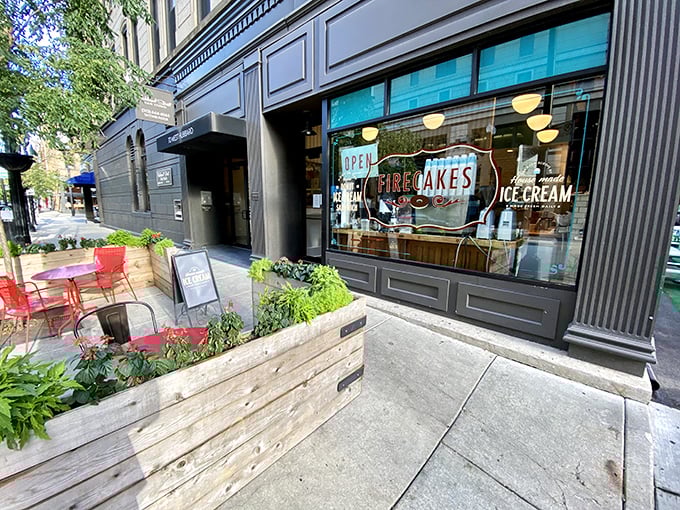 A teal oasis in the concrete jungle! Firecakes Donuts beckons with its charming storefront, promising sweet salvation for weary urbanites.