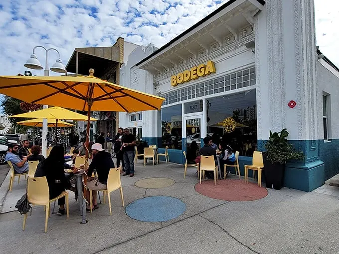 Welcome to flavor town! Bodega's charming exterior is like a postcard from Havana, complete with sunny yellow umbrellas inviting you to stay awhile.