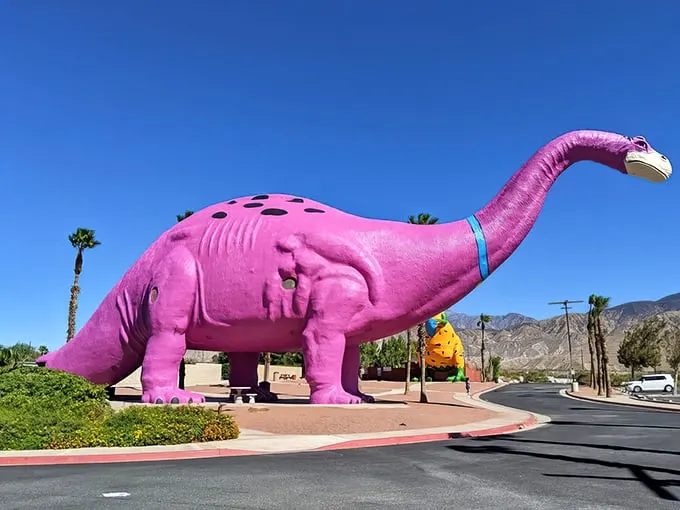 Jurassic Park meets Barbie's Dream House! This hot pink dino is serving prehistoric realness with a side of California cool.