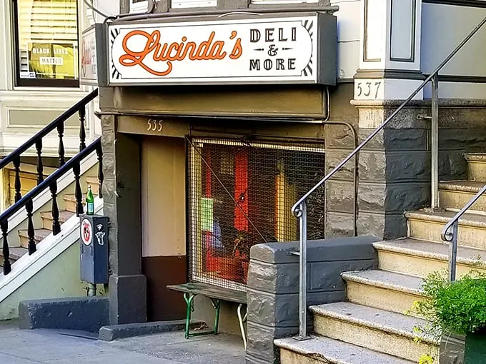 Welcome to sandwich paradise! Lucinda's charming storefront beckons like a siren song to hungry passersby, promising delicious adventures within.