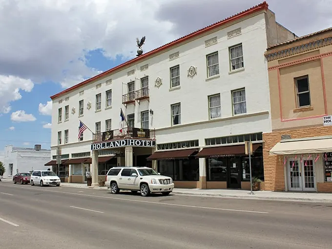 Welcome to Alpine, where the Holland Hotel stands like a sentinel guarding the town's history. This isn't just a place to rest your head—it's a time machine with room service!