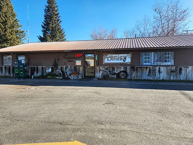 Welcome to the Rusty Lantern Diner, where charm is served in heaping portions! This quaint exterior, adorned with colorful flowers, promises a feast for both eyes and stomach.