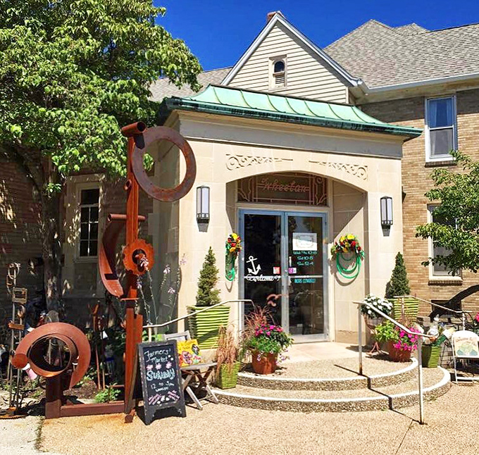 Welcome to Skeleton Key, where time travel is just a doorknob turn away! This charming facade hints at the treasures within, complete with a rusty sculpture that's part modern art, part conversation starter.