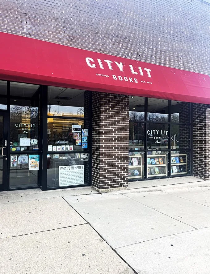 "Welcome to the literary oasis! City Lit Books stands proud, its red awning a beacon for bibliophiles. It's like a candy store for your brain, minus the sugar crash."