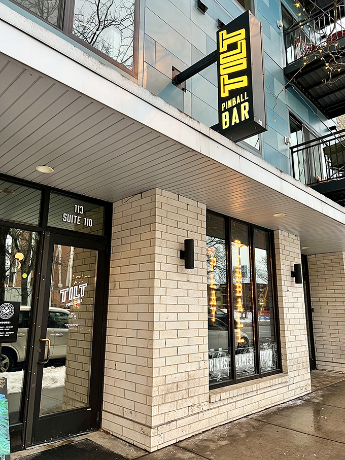 Welcome to LITT Pinball Bar, where the neon sign beckons like a lighthouse for lost souls seeking refuge in nostalgia and craft beer.