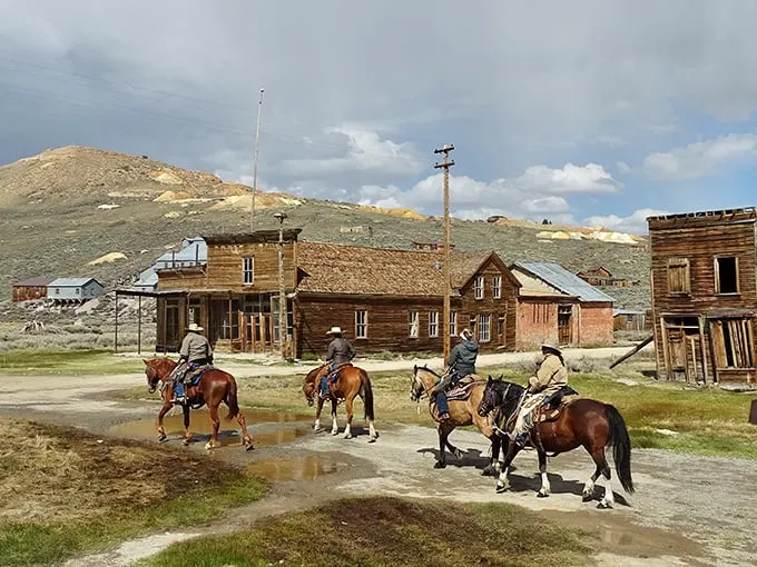 "Rust never sleeps, but this old jalopy sure does!" A weathered vintage car rests peacefully among wooden buildings, telling tales of Bodie's golden days.