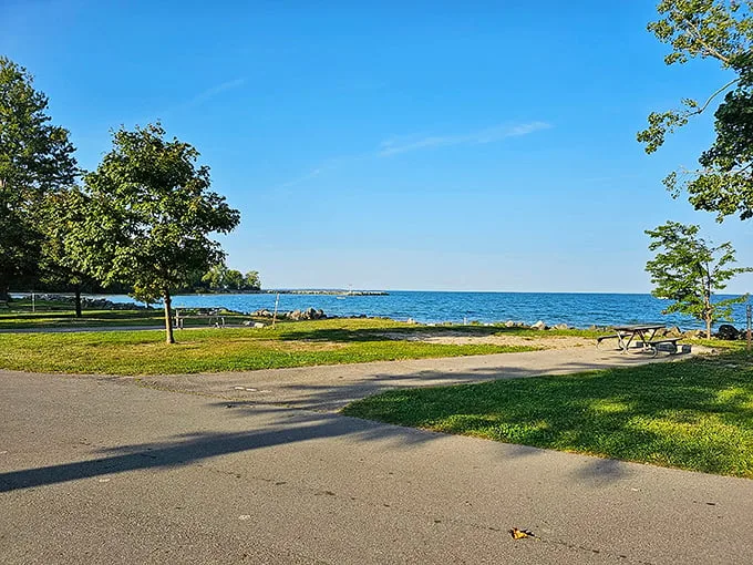 "Lake Erie's siren song: Where the horizon meets possibility." A serene shoreline beckons, promising adventure and relaxation in equal measure at Kelleys Island State Park.