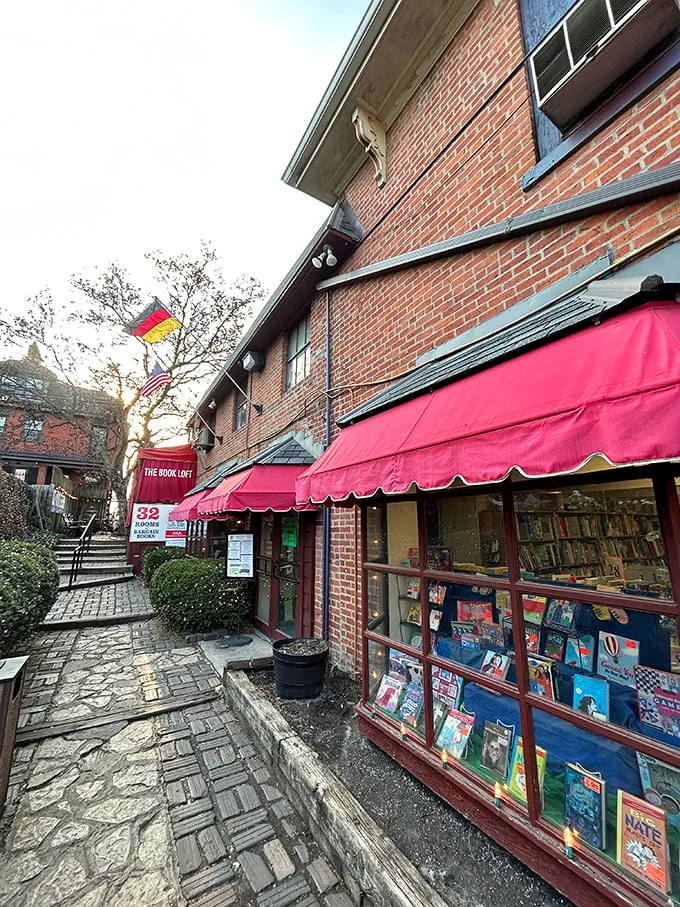 Step into a storybook world! The Book Loft's charming exterior promises literary adventures behind its brick façade and vibrant red awnings.