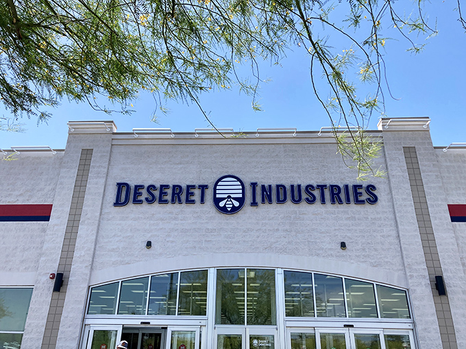 Welcome to the Taj Mahal of thrift stores! Deseret Industries stands proud, a white beacon of bargain-hunting bliss under the azure Arizona sky.