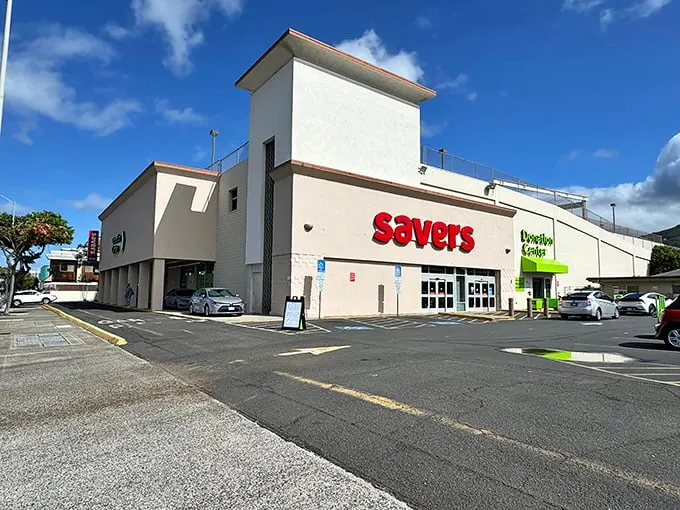 Welcome to bargain paradise! Savers' exterior promises a treasure trove of deals, nestled between palm trees and parked cars. It's like a retail oasis in the urban jungle.