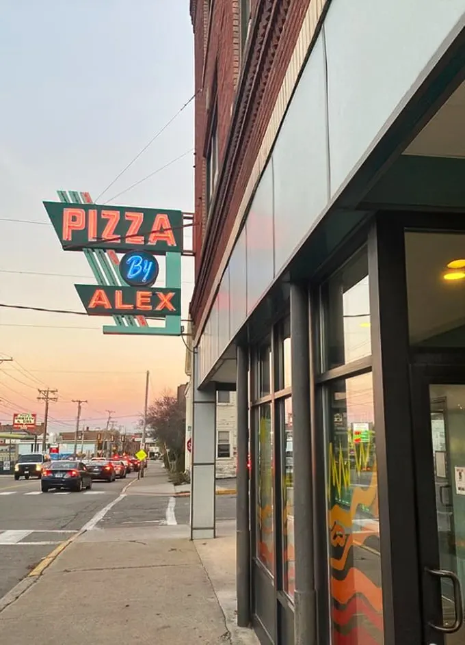 Neon dreams come true! This retro sign beckons pizza lovers like a cheesy lighthouse, guiding hungry souls to their crispy, saucy destiny.