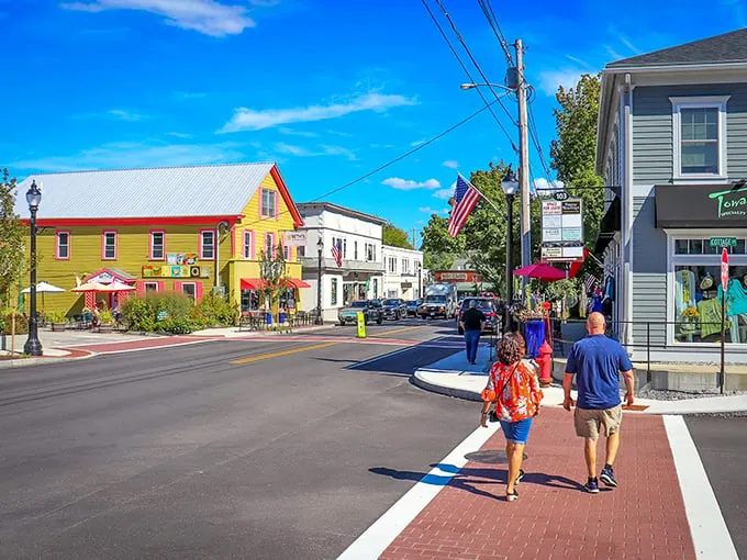 Strolling down this street is like stepping into a Norman Rockwell painting, but with better Wi-Fi. Colorful houses, and American flags – it's quintessential small-town charm with a modern twist.