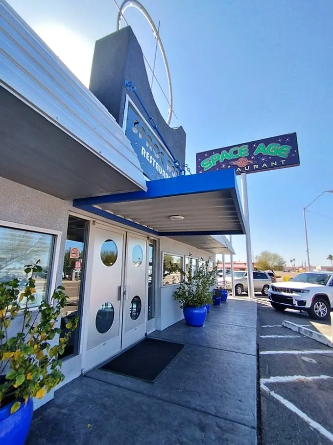 Welcome to the future... of dining! The Space Age Restaurant's exterior is a retro-futuristic feast for the eyes, complete with porthole windows and a sign that screams "The Jetsons were here!"