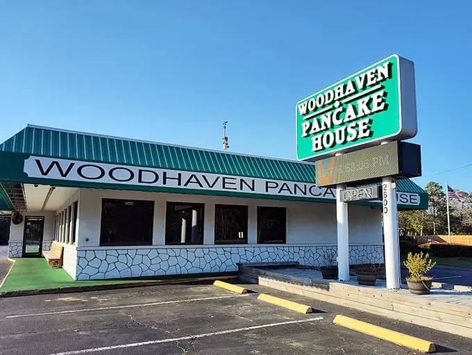 A green-striped awning beckons like a breakfast lighthouse, guiding hungry souls to this unassuming pancake paradise. No frills, just thrills for your taste buds.