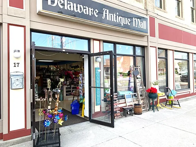 Step right up to the time-travel emporium! The Delaware Antique Mall's facade promises a journey through decades, with colorful flowers hinting at the treasures within.