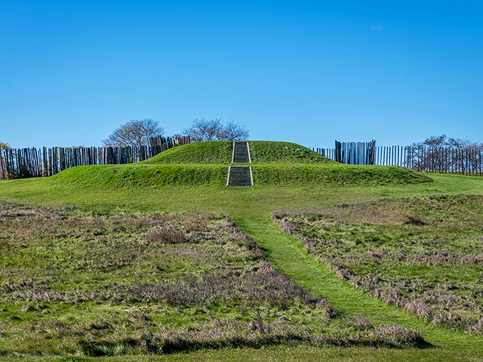 Ancient engineering meets Midwest charm! This grassy mound with its wooden stockade is like a prehistoric skyscraper – minus the elevator and overpriced coffee shop.