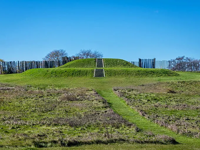 Ancient engineering meets Midwest charm! This grassy mound with its wooden stockade is like a prehistoric skyscraper – minus the elevator and overpriced coffee shop.