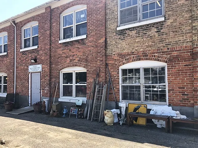 "Welcome to the time machine!" This weathered brick facade holds more stories than your grandma's photo album. Step inside and prepare for a journey through the decades.