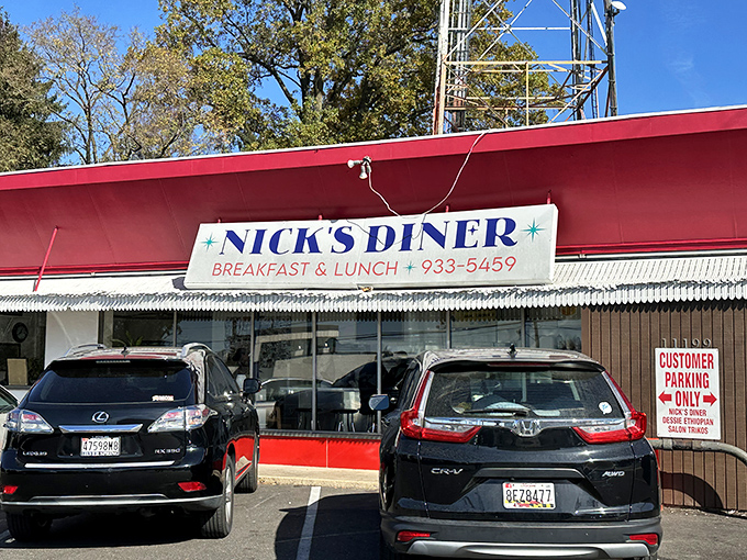 A beacon of breakfast bliss! Nick's Diner's vibrant red exterior is like a siren call to hungry souls, promising comfort food and nostalgia in equal measure.
