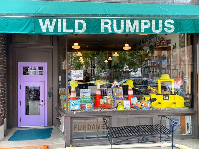 Welcome to Wild Rumpus, where books and adventure collide! This whimsical storefront, complete with a child-sized purple door, promises literary delights for all ages.