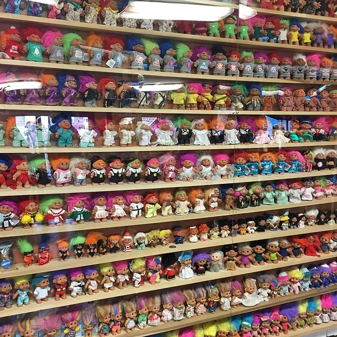 A rainbow explosion of nostalgia! These shelves are like a time machine, transporting you back to the days when hair was big and worries were small.