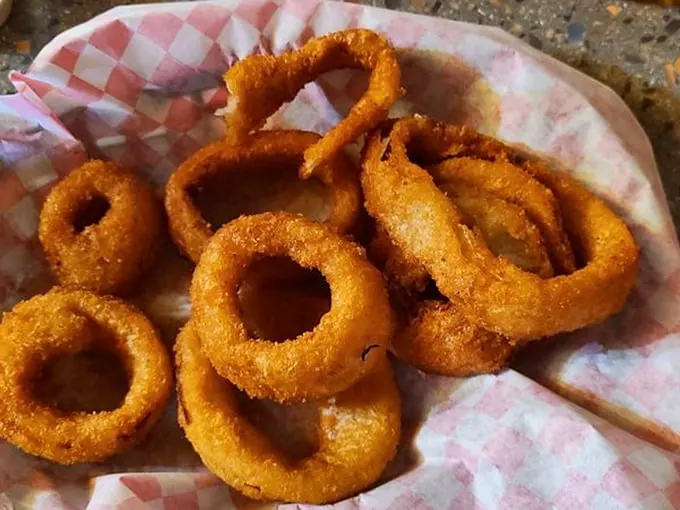 Crispy, golden halos of happiness. These onion rings are so good, they might just make you believe in deep-fried miracles.