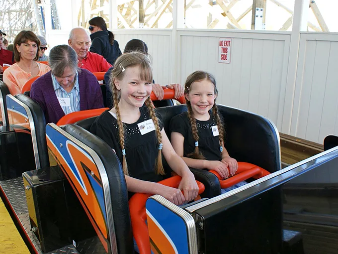 Start 'em young! These little daredevils are about to embark on a rite of passage that'll have them hooked on coasters for life.