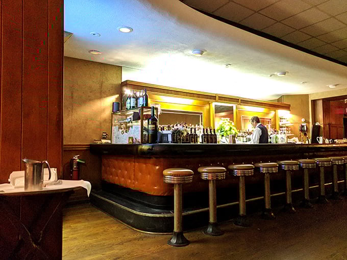 Pull up a stool! This classic bar, with its gleaming wood and cushy seats, invites you to belly up for a cocktail and conversation.