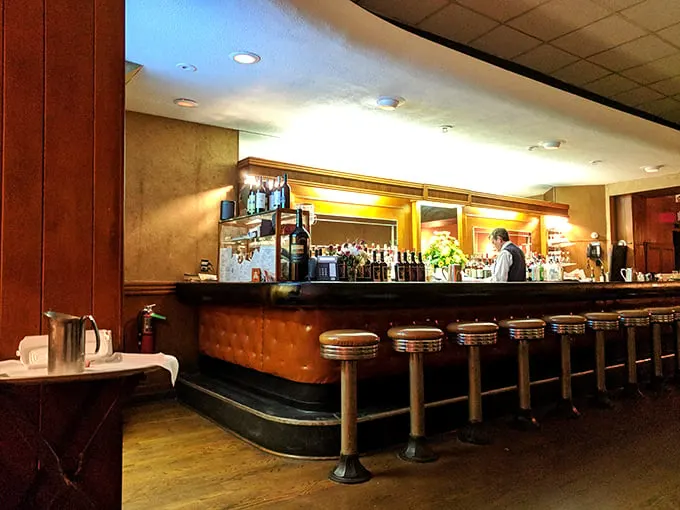 Pull up a stool! This classic bar, with its gleaming wood and cushy seats, invites you to belly up for a cocktail and conversation.