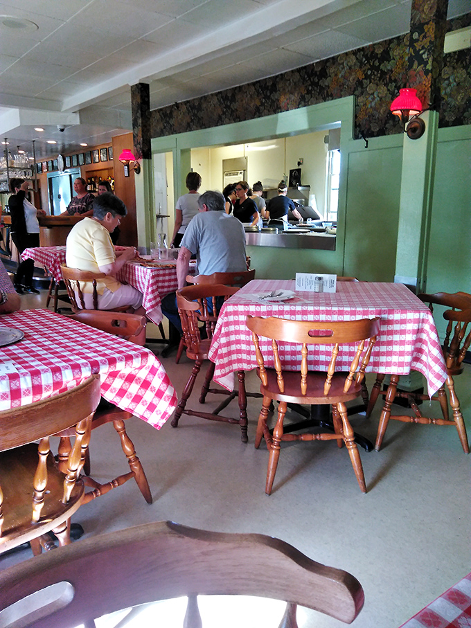 Red and white checkers everywhere! It's like a picnic indoors, minus the ants and with 100% more pizza.
