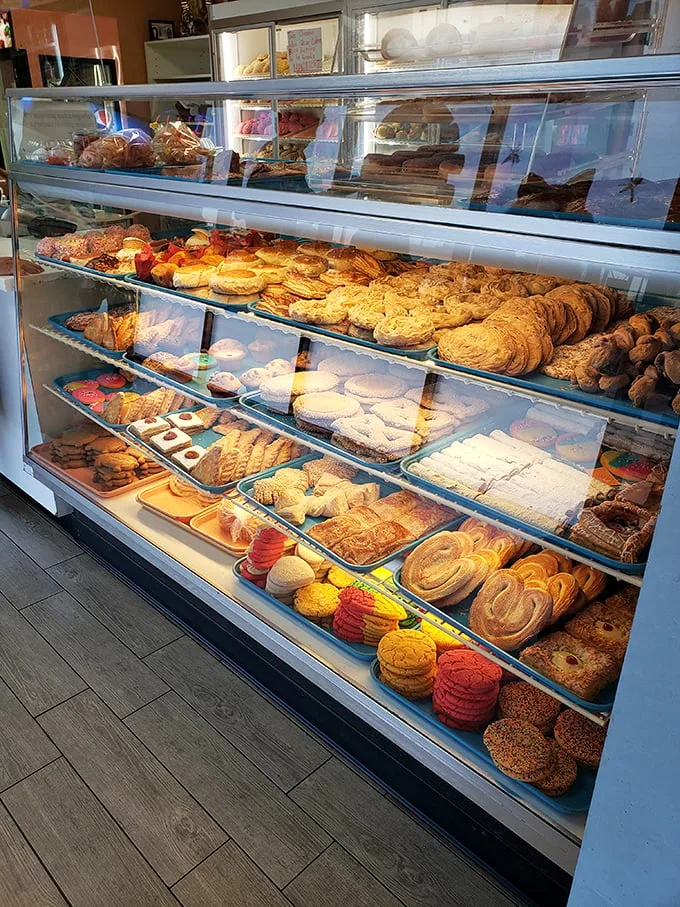 A glass case of emotion... and pastries! This display is like a museum of mouthwatering masterpieces, each one begging to be devoured.