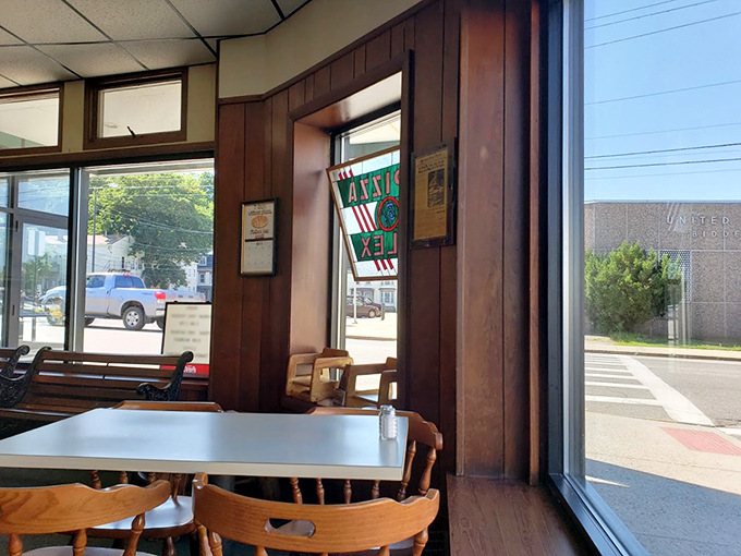 A room with a view... of more pizza! This window seat is prime real estate for people-watching and pie-devouring.