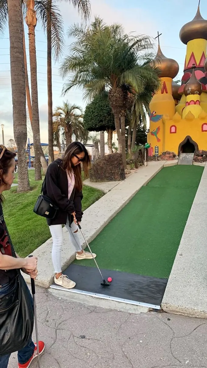 Concentration is key! These golfers are so focused, you'd think they were diffusing a bomb instead of sinking a putt.