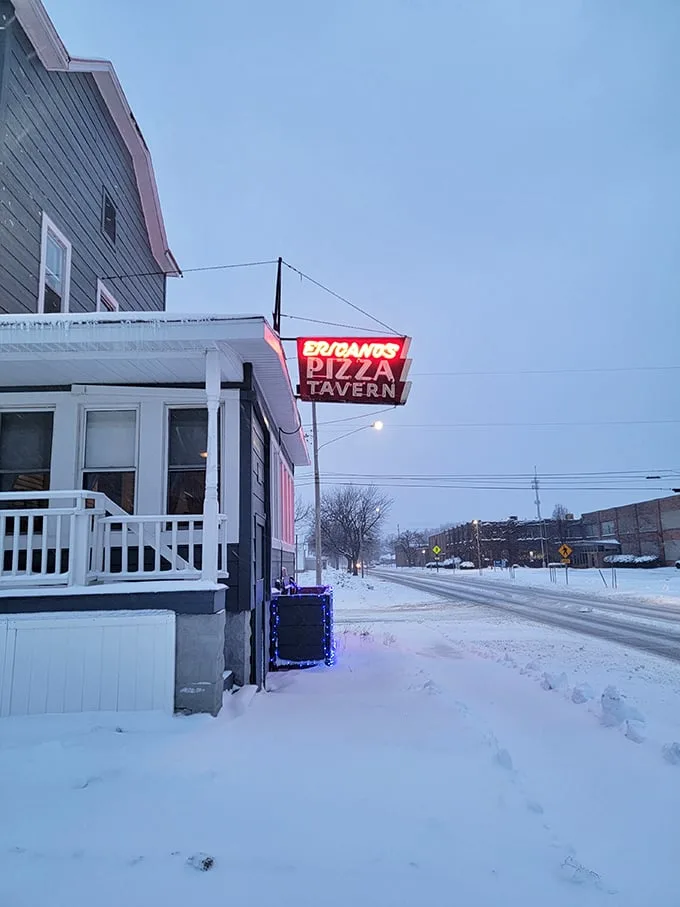A winter wonderland of pizza! Even in the snow, Fricano's red sign shines like a beacon for hungry travelers.
