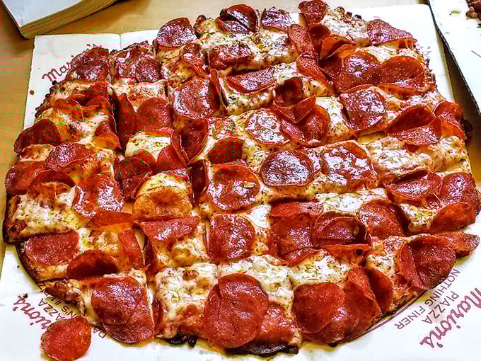 Pepperoni perfection! This pizza is so loaded, it's like a "Where's Waldo?" of meat – can you spot any crust under all that goodness?