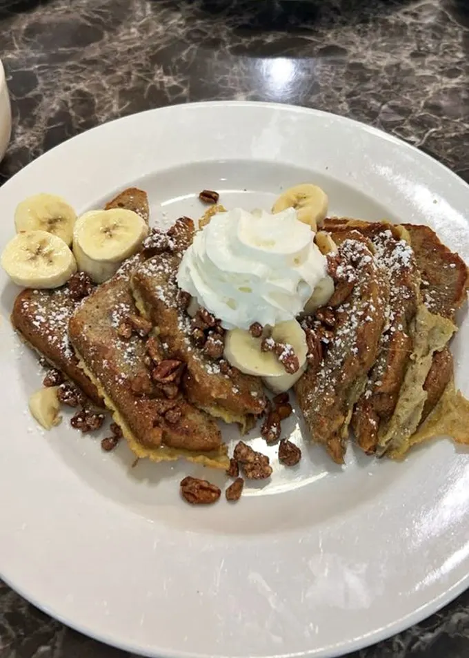 French toast that puts the "ooh" in "ooh la la"! Topped with enough goodies to make even Marie Antoinette say, "Let them eat this instead!"