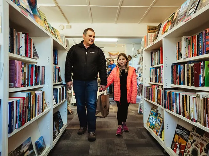 Family bonding over books – a heartwarming scene that's better than any Hallmark movie. Pass the reading glasses, not the remote!